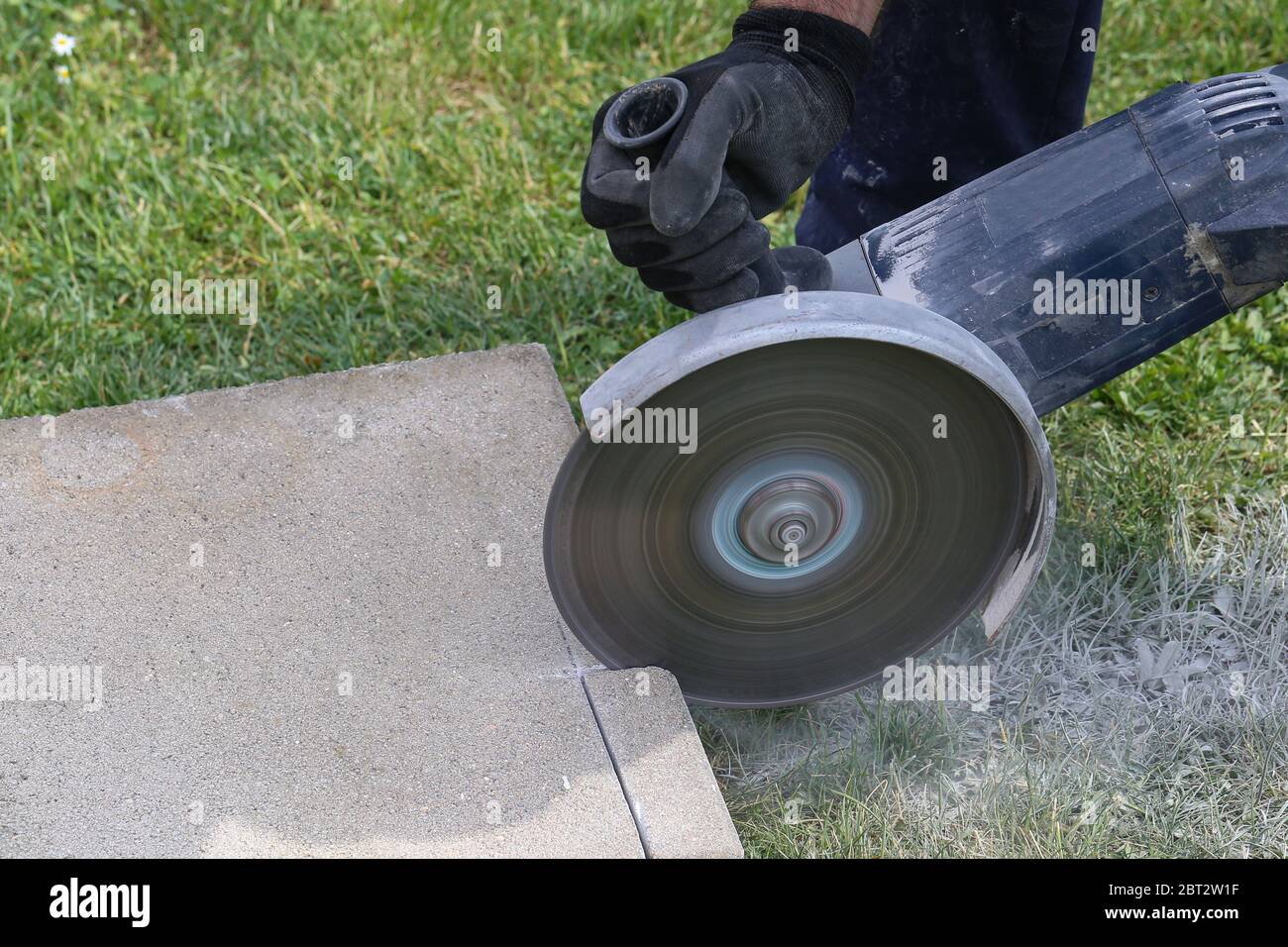 Industrial construction worker using a professional angle grinder Stock ...