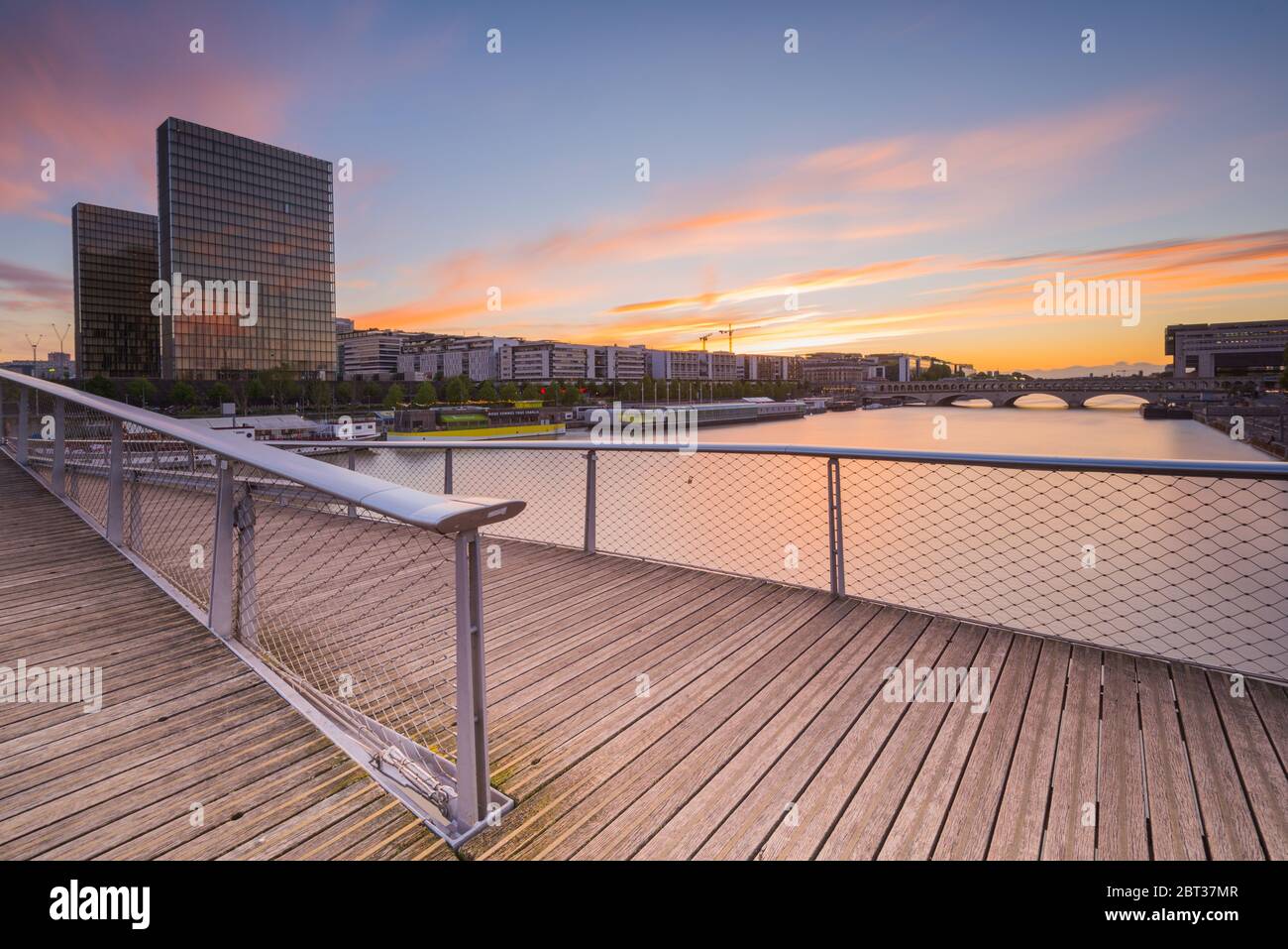 National Library of France from Simone de Beauvoir bridge at sunset ...