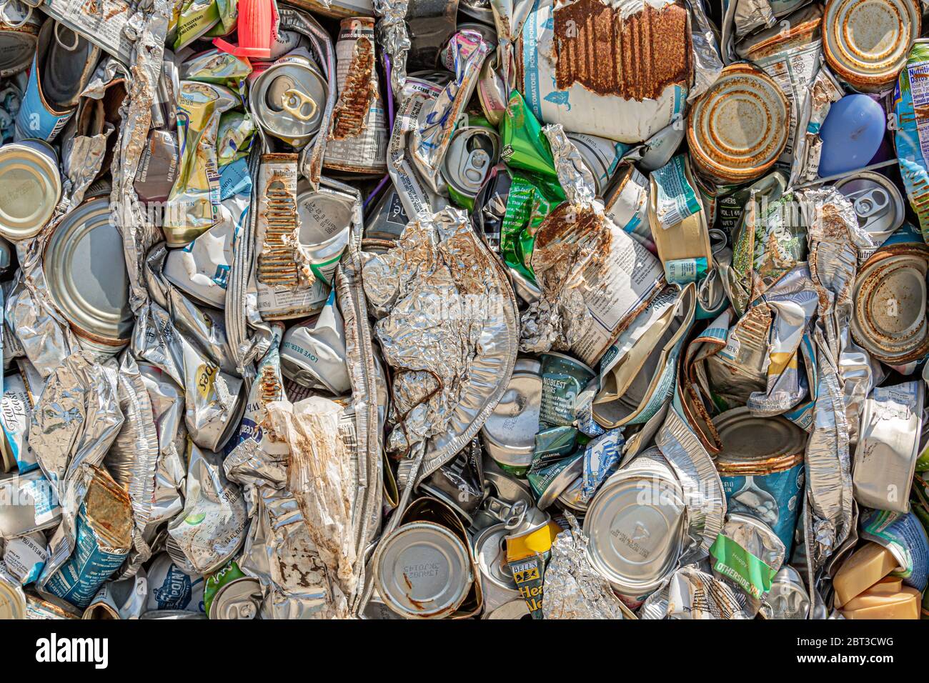crushed metal consumer recyclables a the dump Stock Photo - Alamy