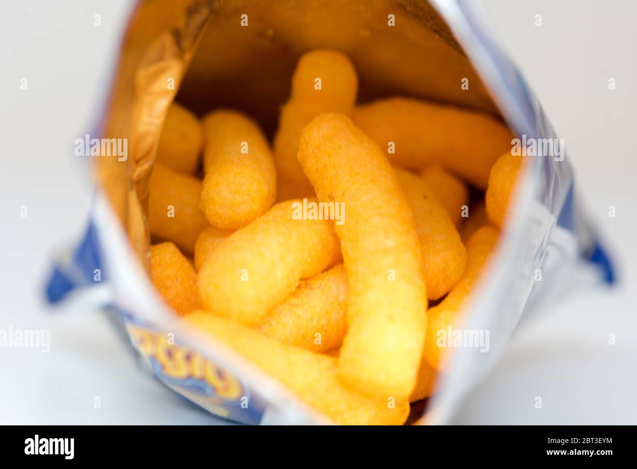 Cheese puff snack wotsits in packet Stock Photo - Alamy