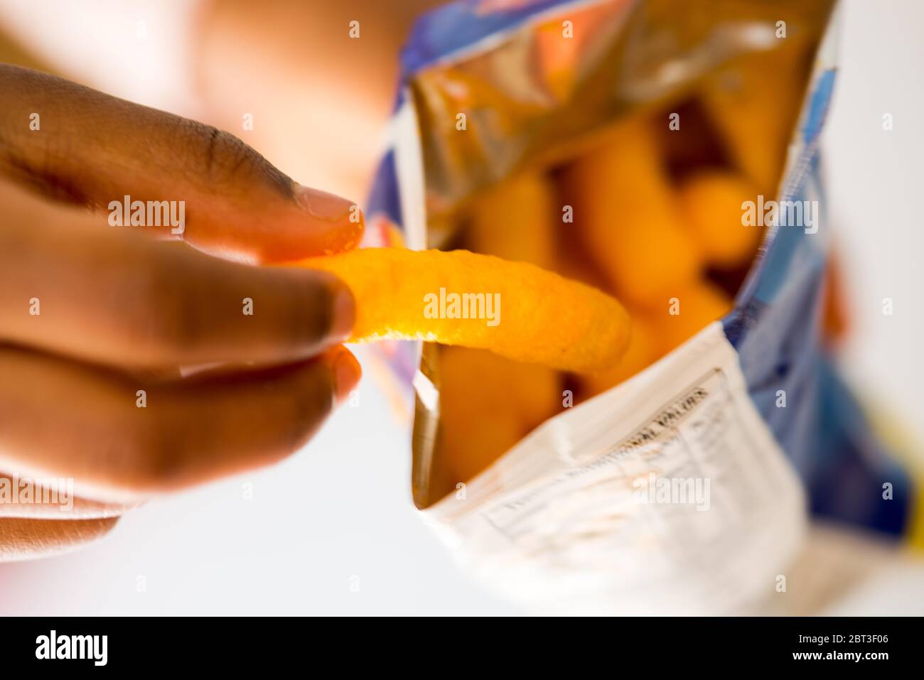 Cheese puff snack wotsits in packet Stock Photo - Alamy