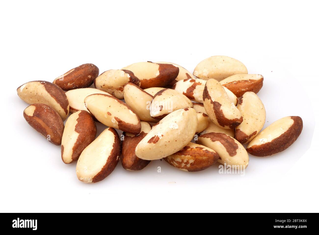 Organic brazil nuts isolated on white background Stock Photo - Alamy