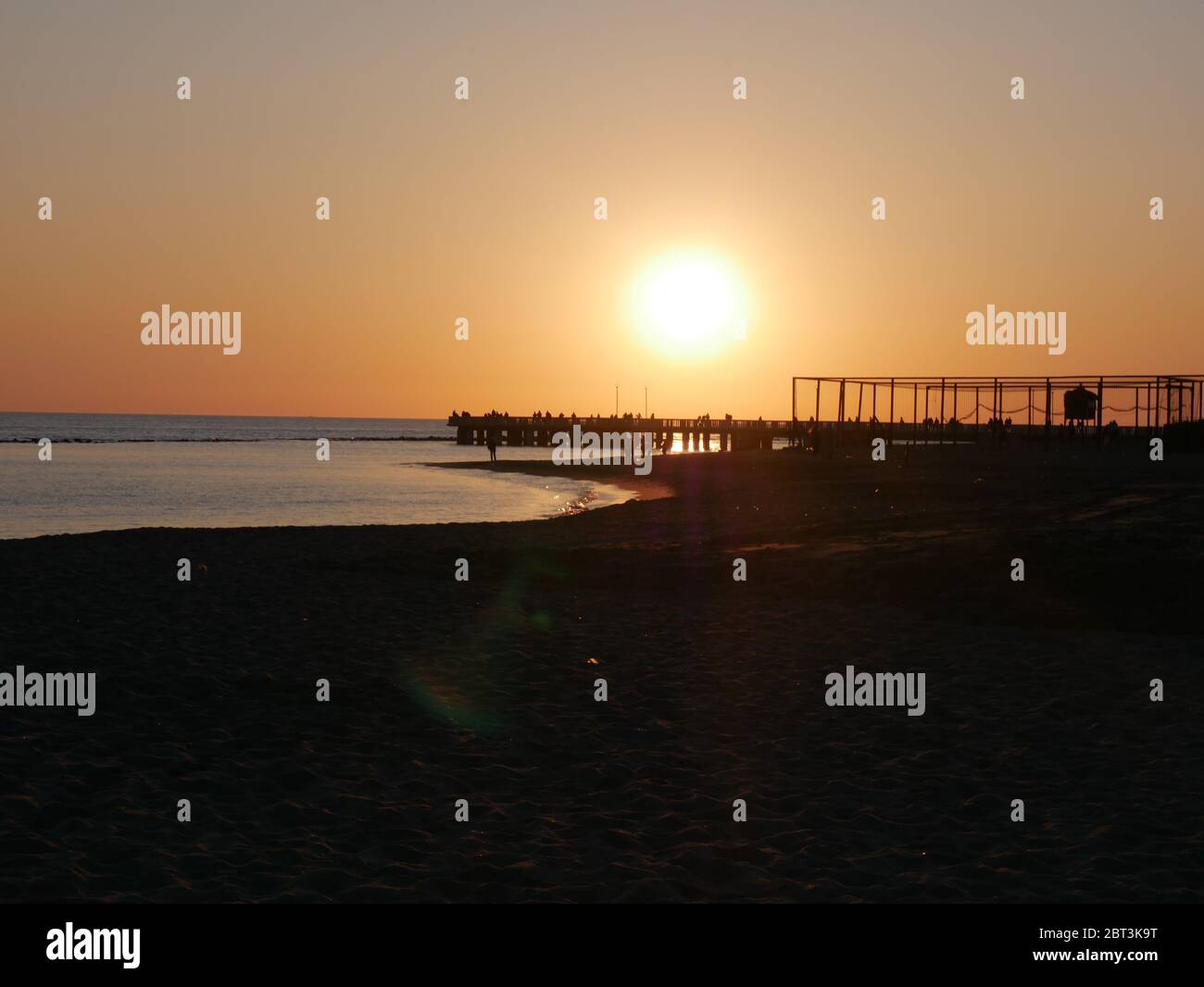 A beautiful sunset on the beach in italy Stock Photo - Alamy