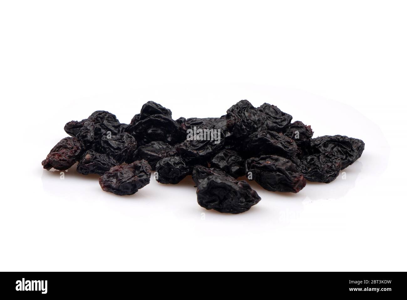 Organic Black raisins on white background Stock Photo - Alamy