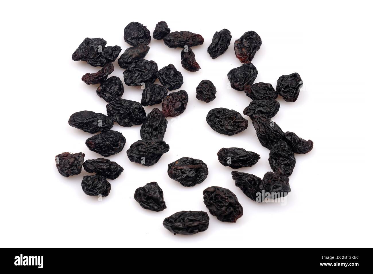 Organic Dark raisins isoalted on white background Stock Photo - Alamy
