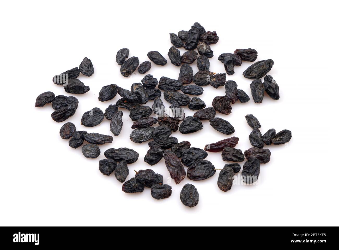 Organic Black raisins on white background Stock Photo - Alamy
