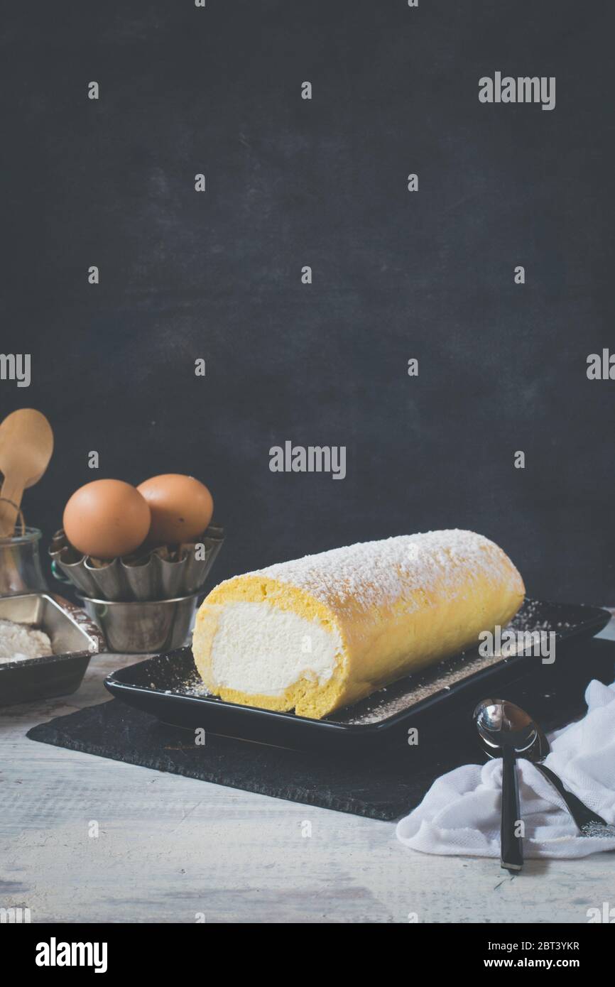 Baked Cream roll with icing sugar Stock Photo - Alamy