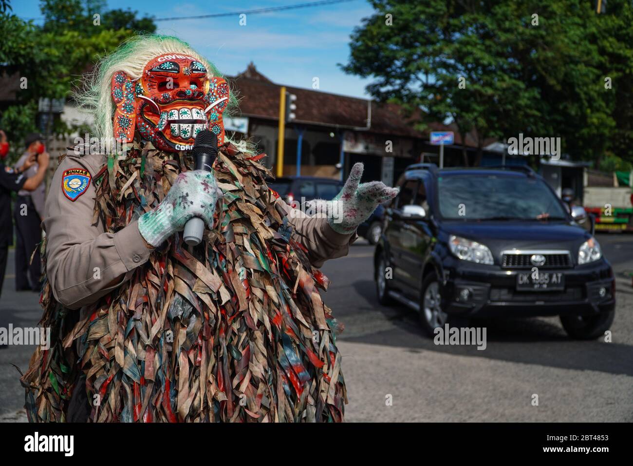 Badung, Bali, Indonesia. 21st May, 2020. A police officer wearing ...