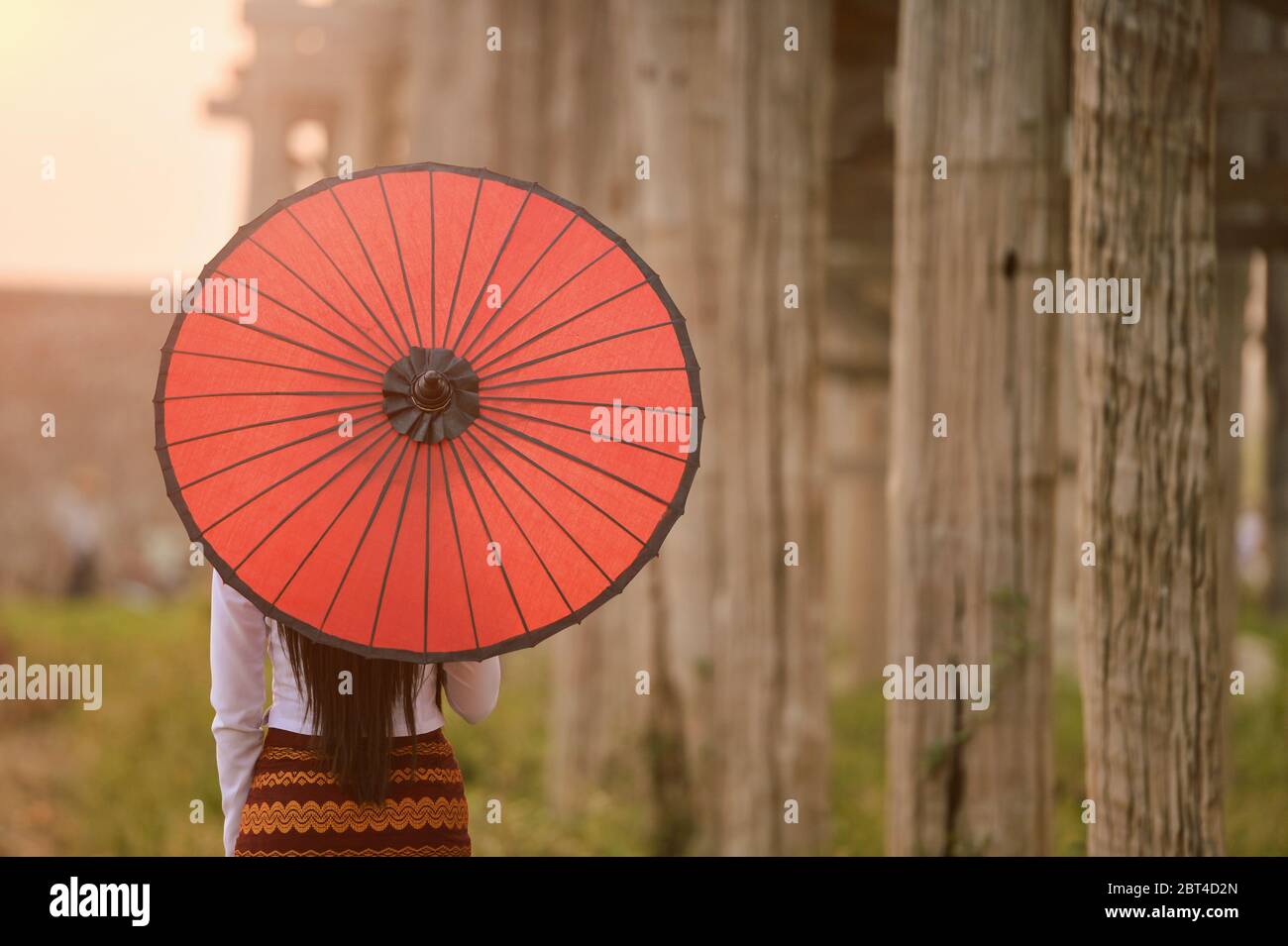 Woman holding parasol hi-res stock photography and images - Alamy