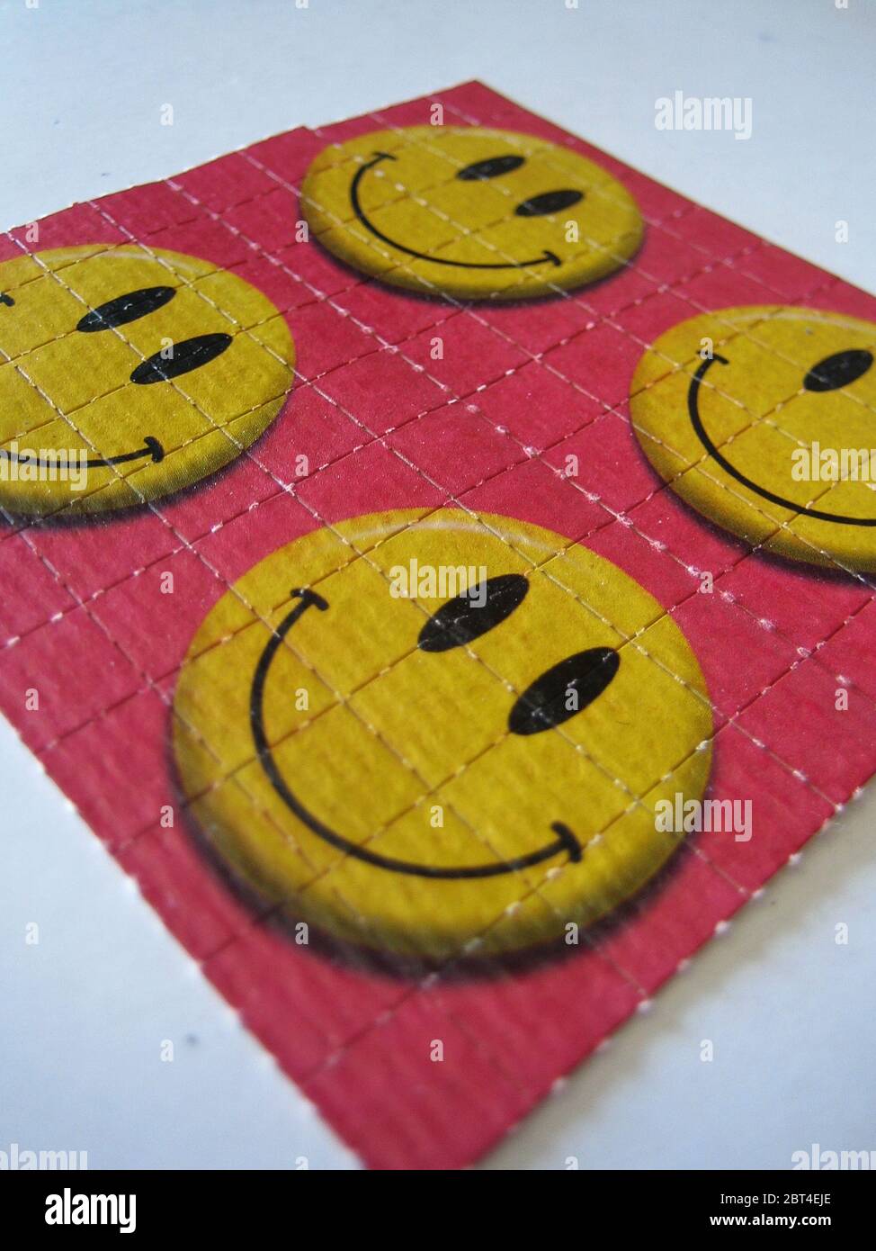 Lsd stick papers smile face retro psychedelic macro vintage background print Stock Photo - Alamy