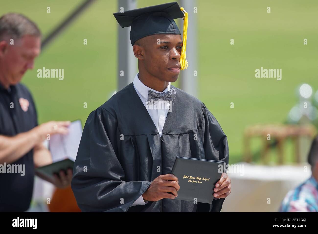 Fort Worth, United States. 21st May, 2020. Jabari Anderson receives his ...