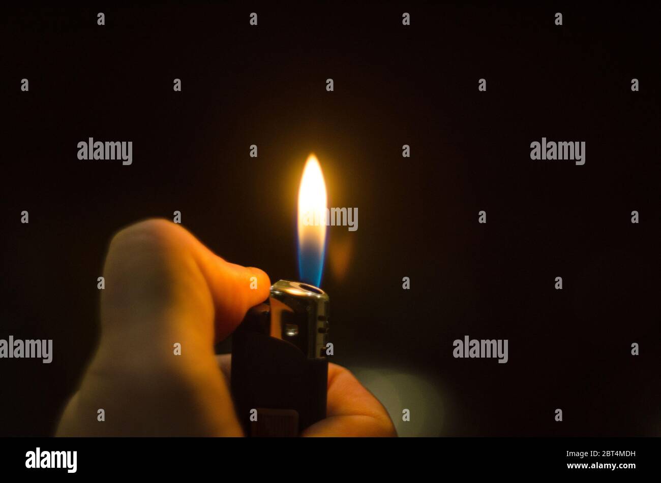 Thumb on lighter hi-res stock photography and images - Alamy