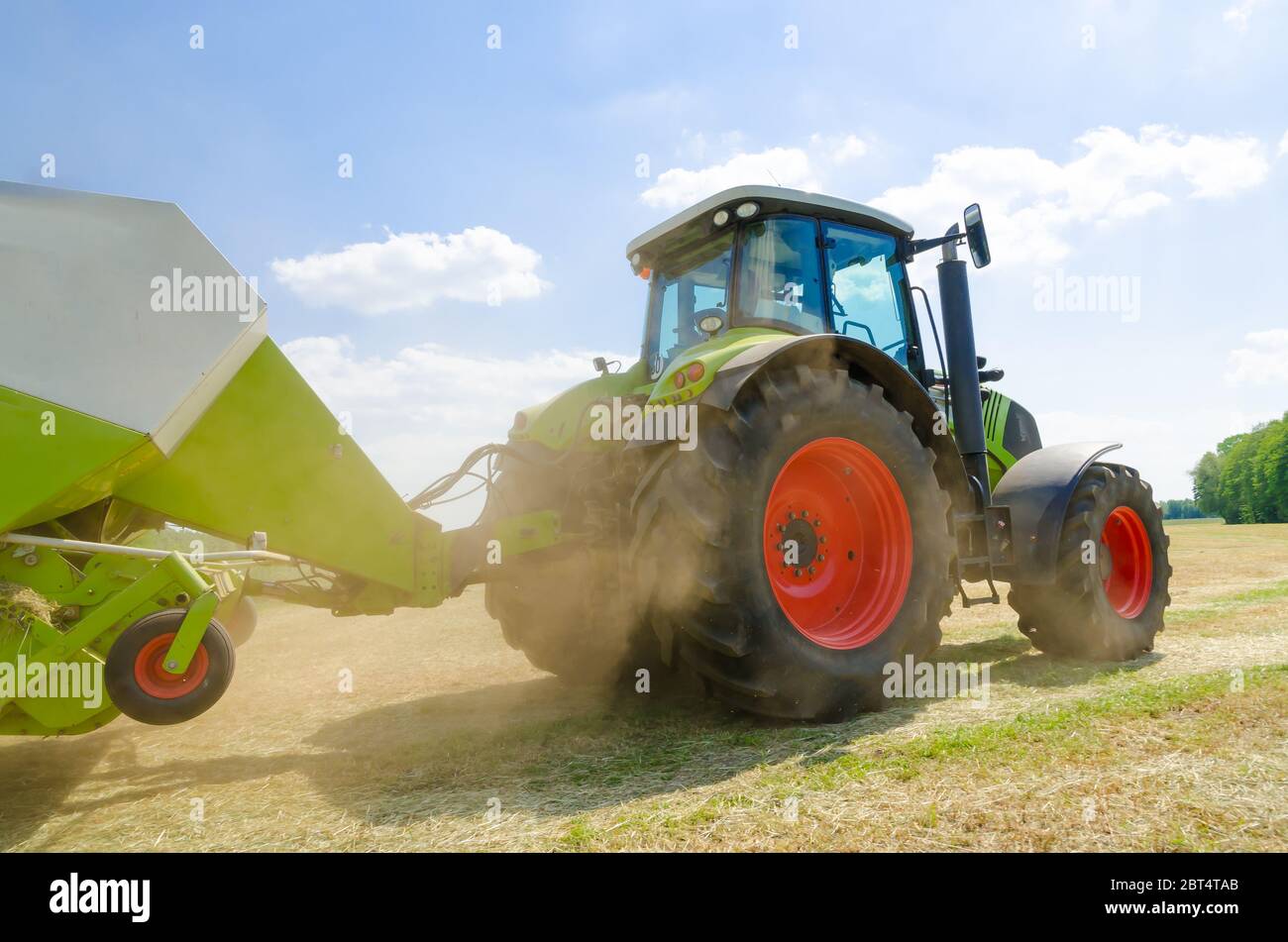 tractor with baler Stock Photo - Alamy