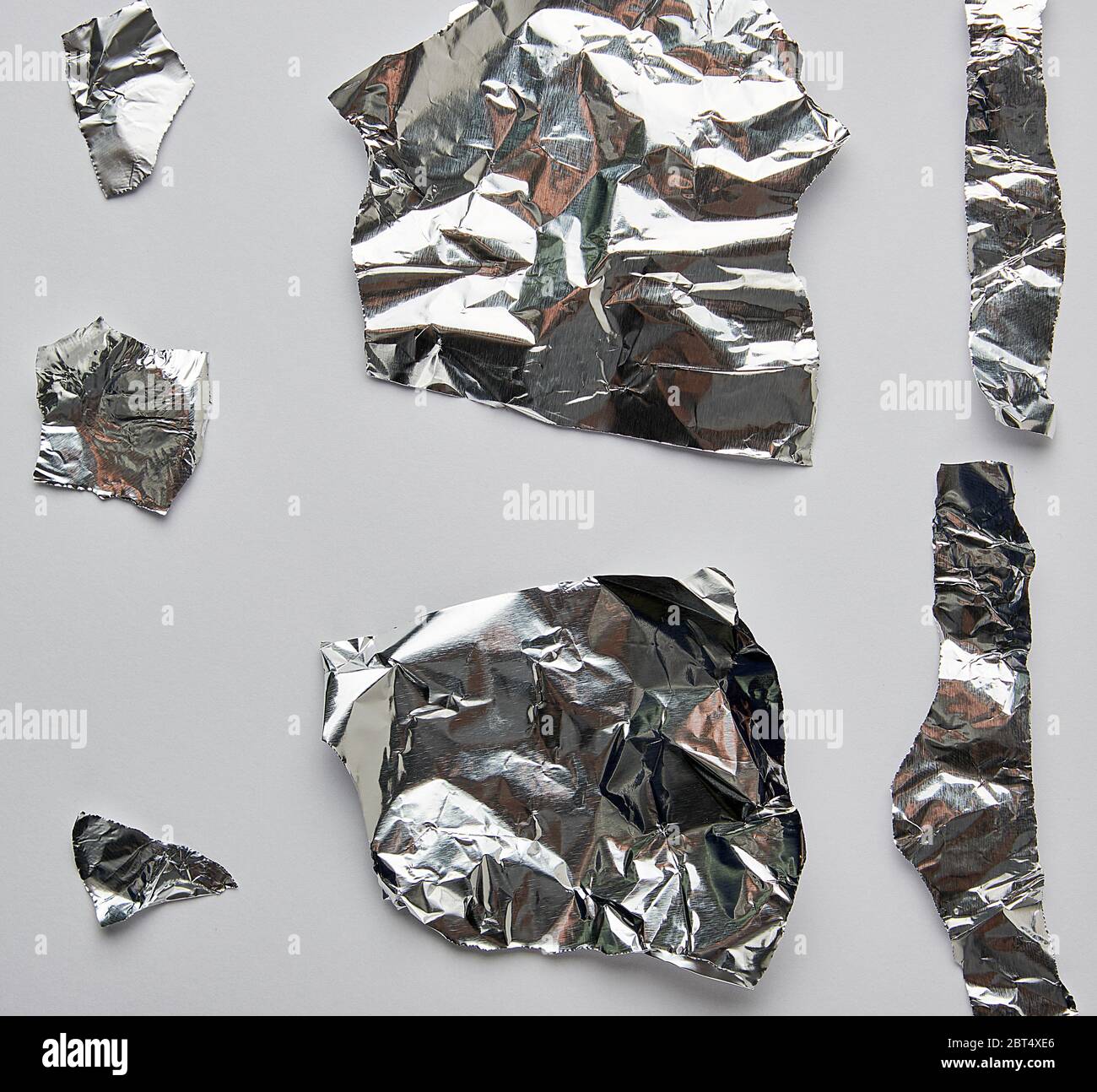 various pieces of foil on a white background, close up Stock Photo - Alamy