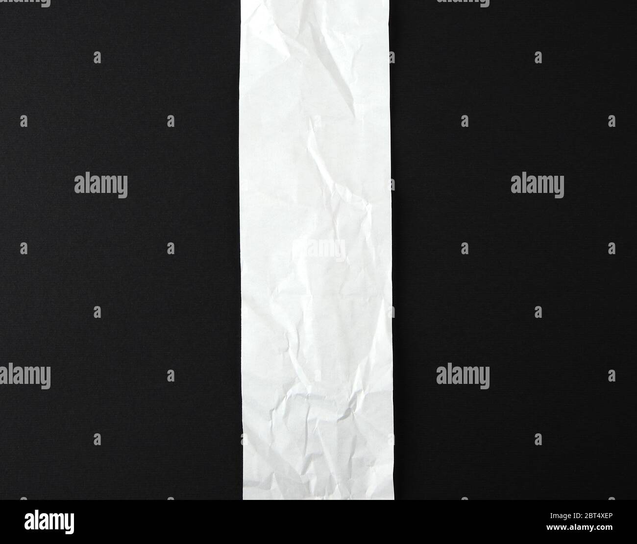 blank strip of paper on a black background, close up Stock Photo - Alamy