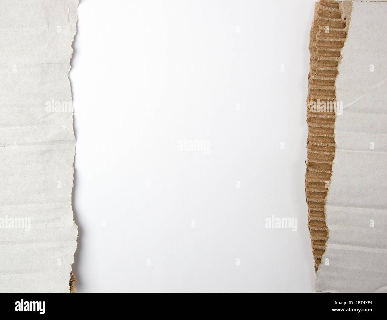 torn piece of paper from under the box in half on a white background ...