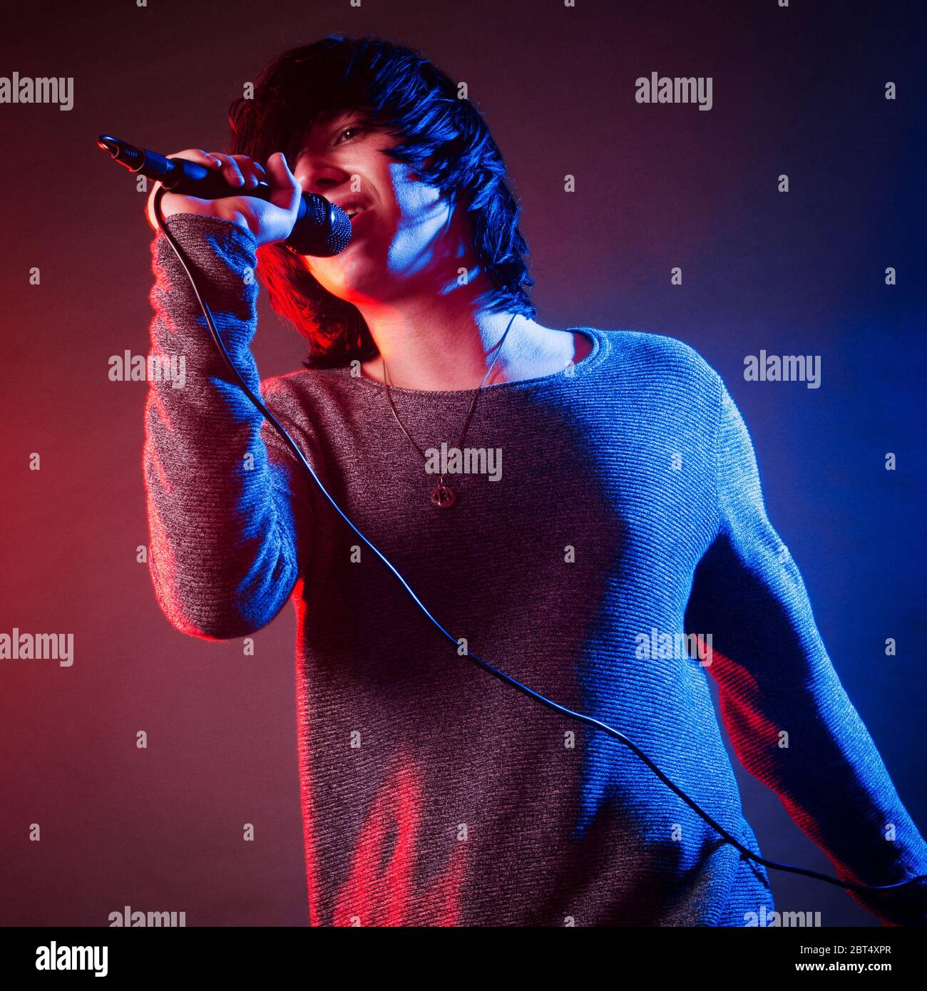 Teen Boy Singing On Stage High Resolution Stock Photography and Images ...