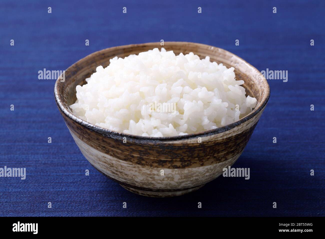 Japanese cooked white rice in a bowl. Japanese staple food Stock Photo ...