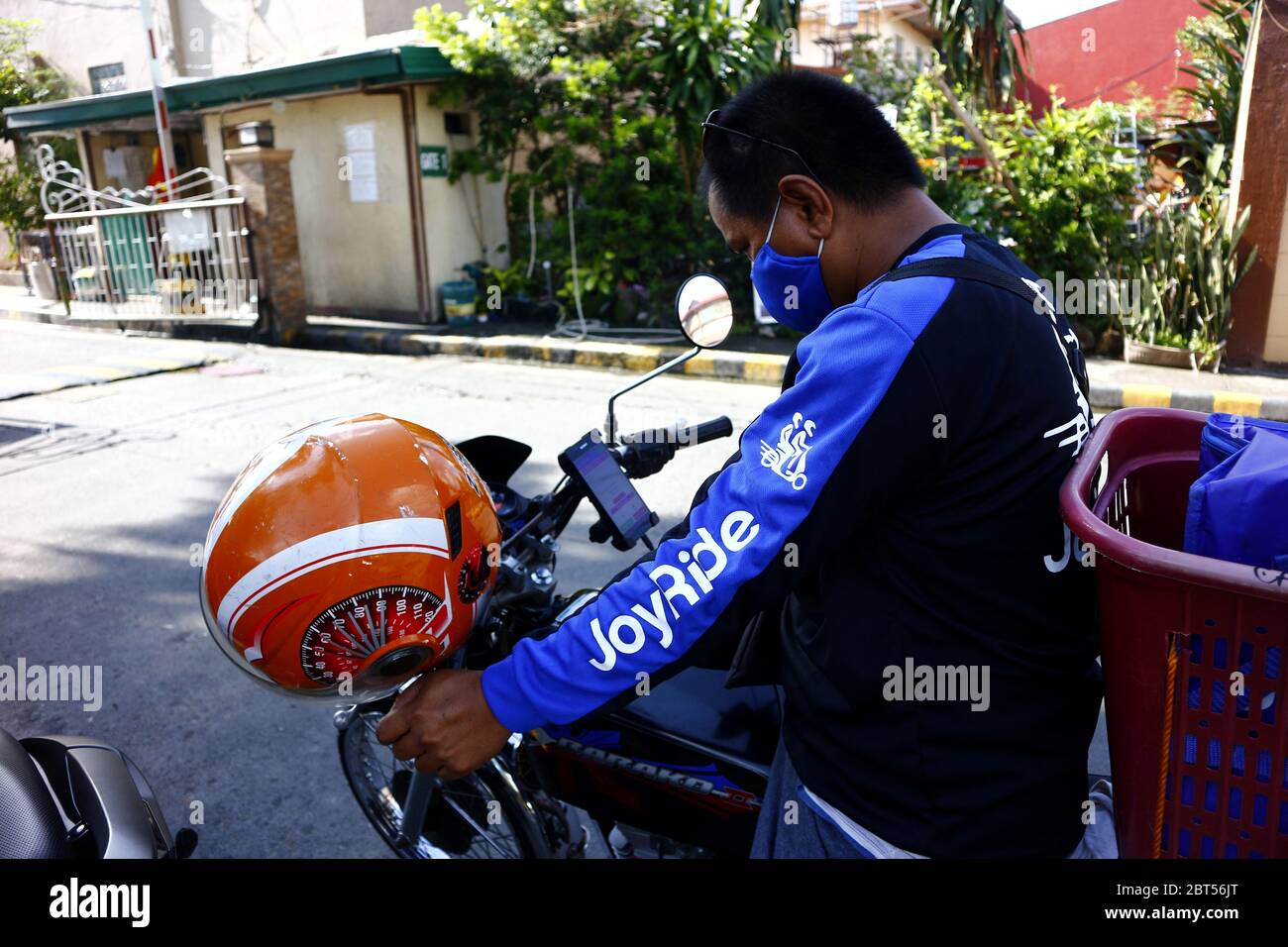 Antipolo City, Philippines - May 21, 2020: Riders of a motorcycle taxi ...