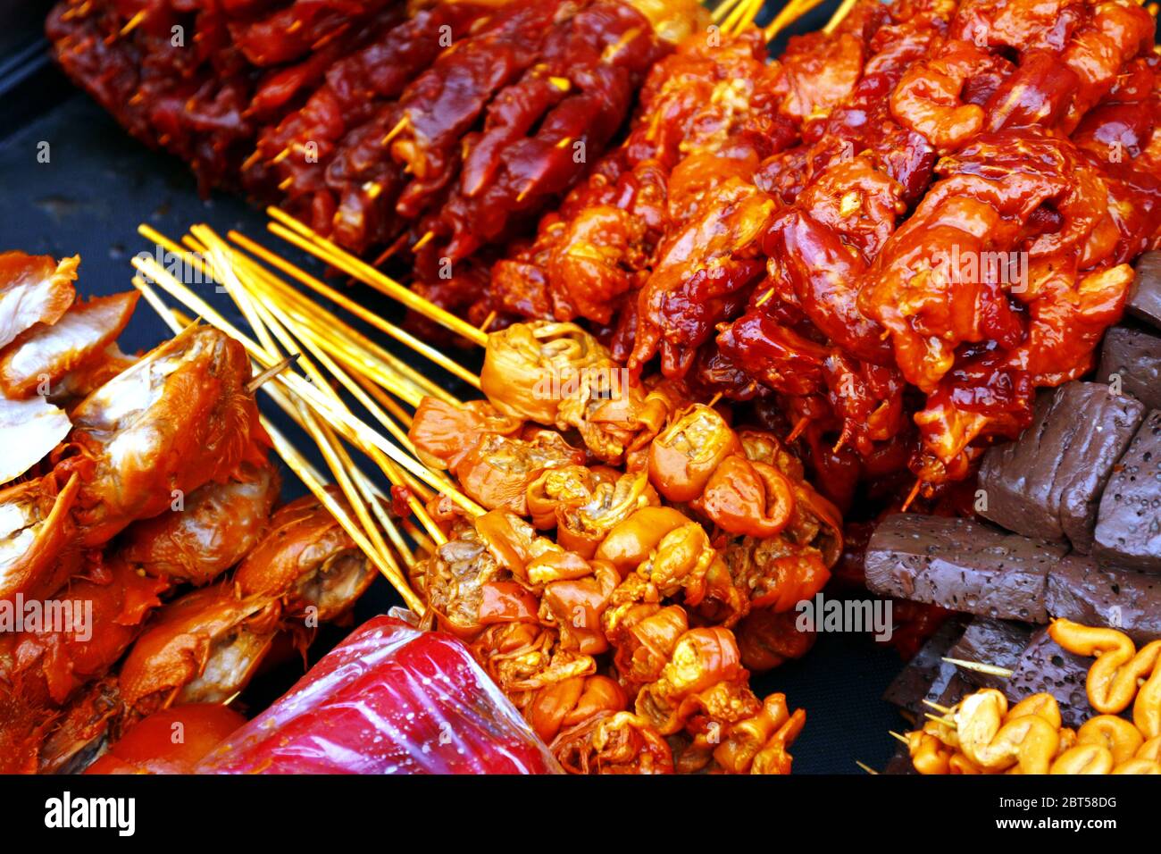 Photo of assorted grilled pork and chicken innards barbecue at a street ...