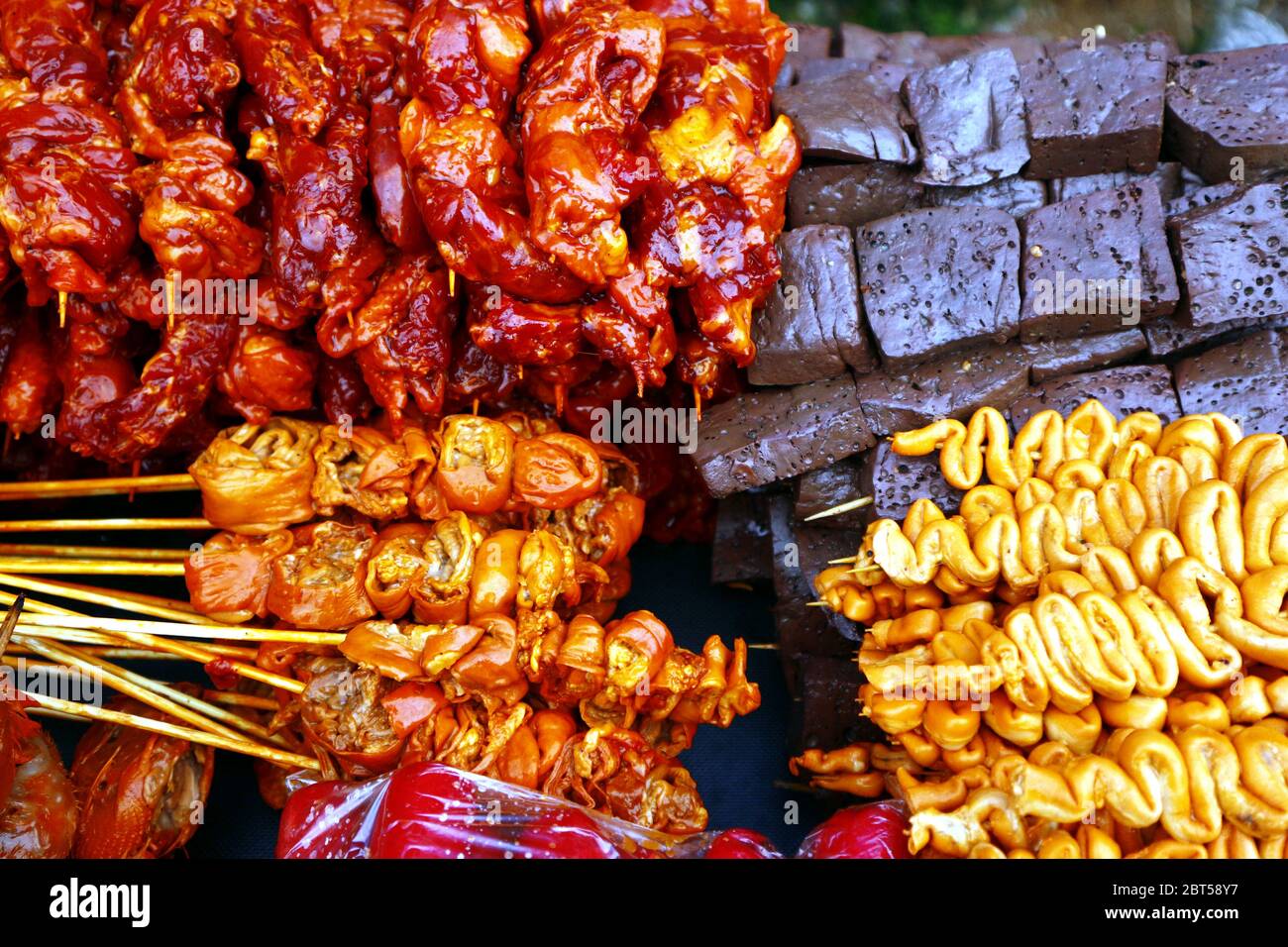 Photo of assorted grilled pork and chicken innards barbecue at a street ...