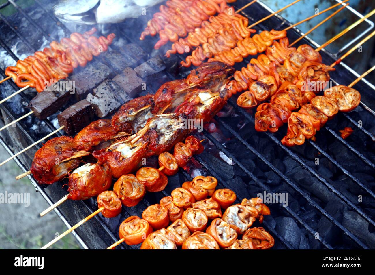 Photo of assorted grilled pork and chicken innards barbecue at a street ...