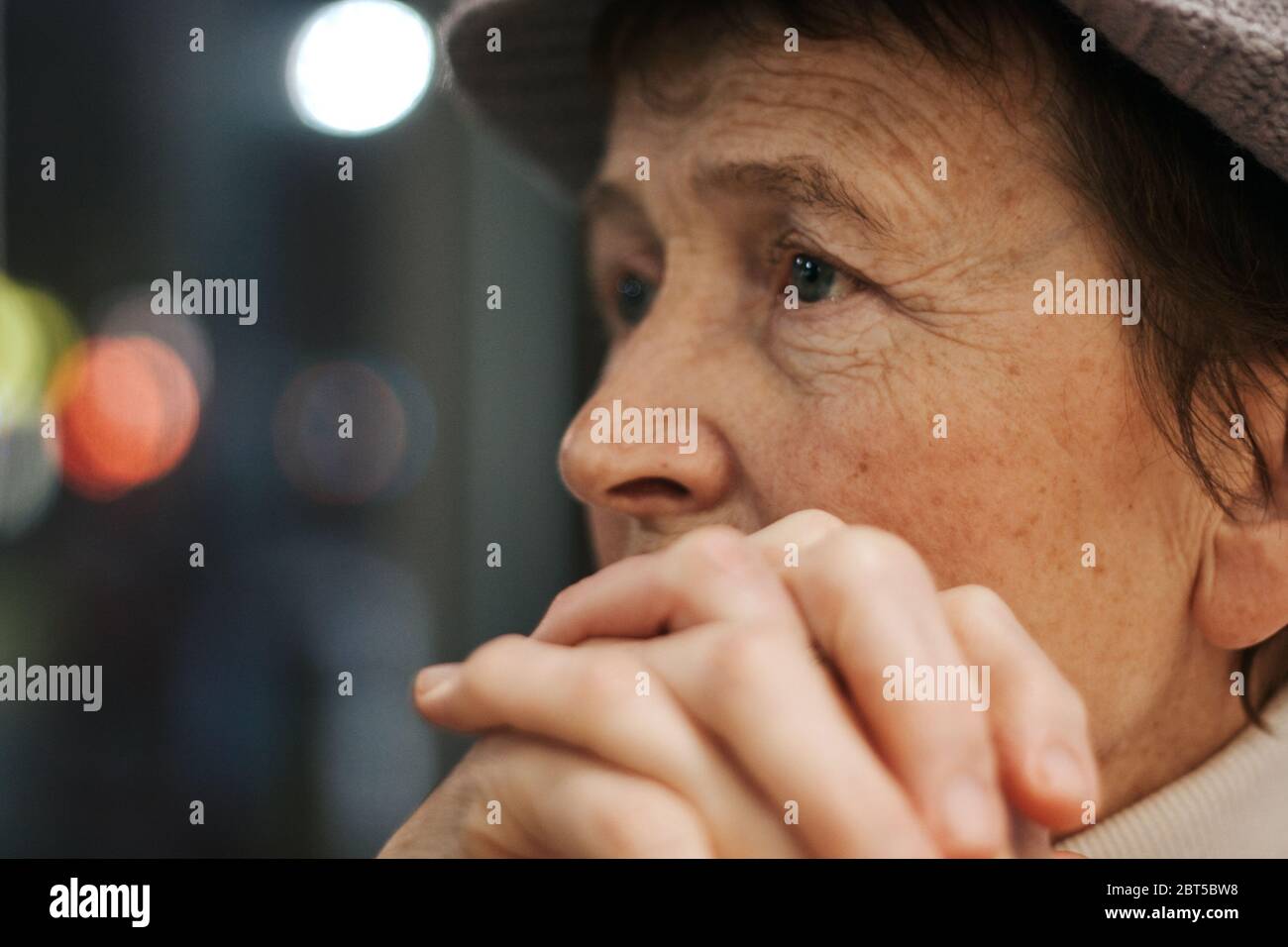 Closeup portrait of sad Caucasian old woman. Beautiful pensive upset ...