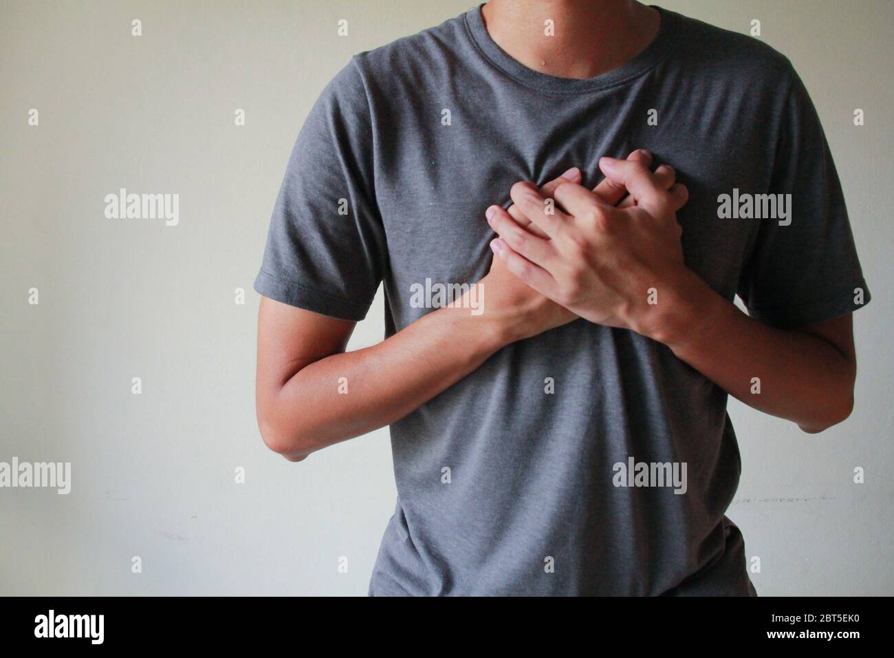The man suffering from chest pain heart attack Stock Photo - Alamy