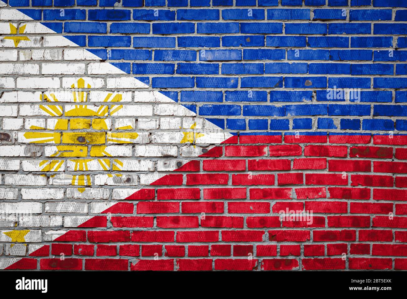 National flag of Philippines depicting in paint colors on an old brick ...