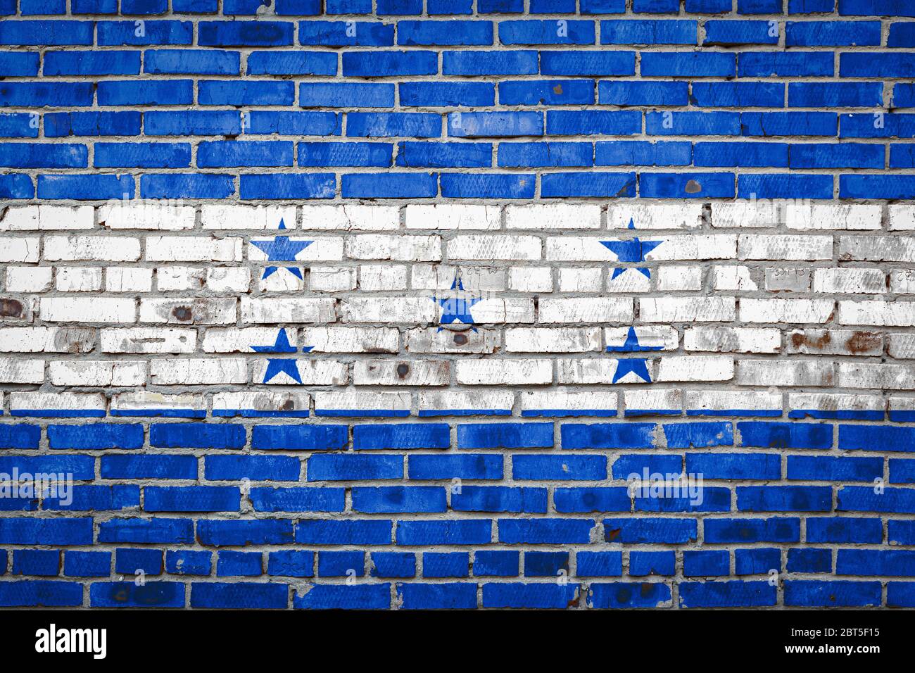 National flag of Honduras depicting in paint colors on an old brick ...