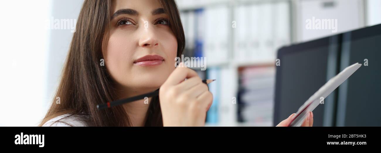 Pretty designer thoughts in work Stock Photo - Alamy