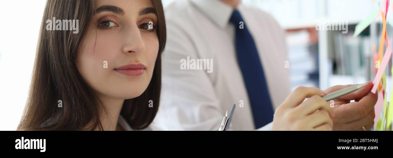 Pretty female colleague in office Stock Photo - Alamy