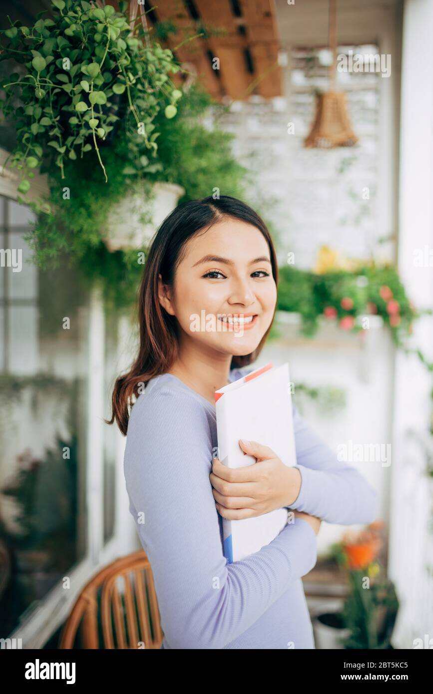 Woman thinking on terrace hi-res stock photography and images - Alamy