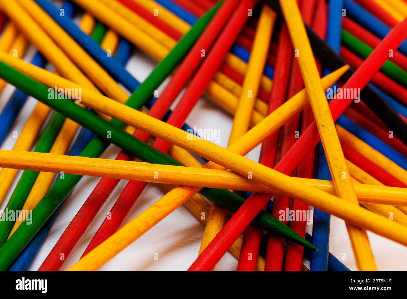 game pick stick with lots of small colored wooden bars Stock Photo - Alamy