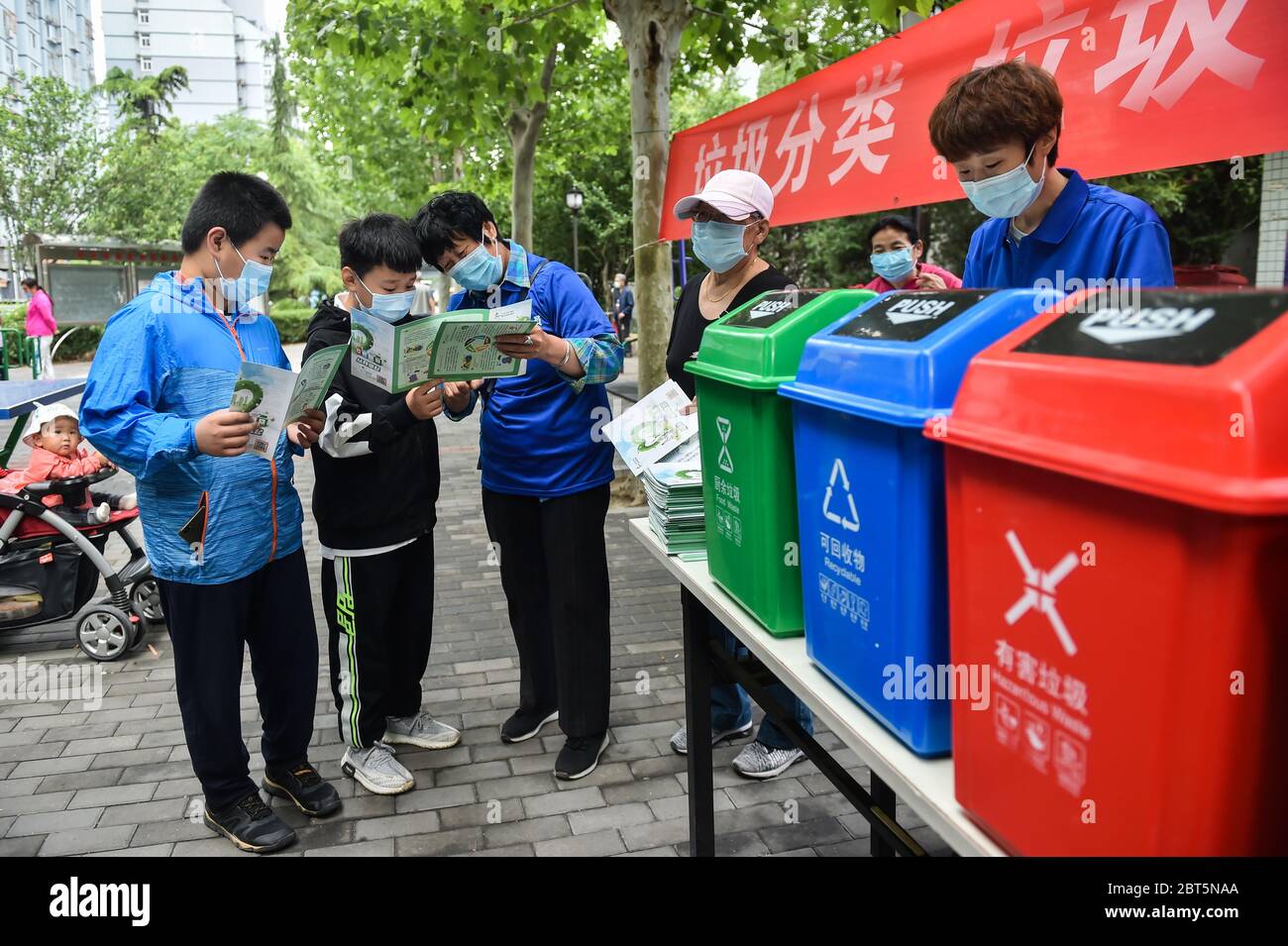 Beijing, China. 23rd May, 2020. Two children learn about garbage ...