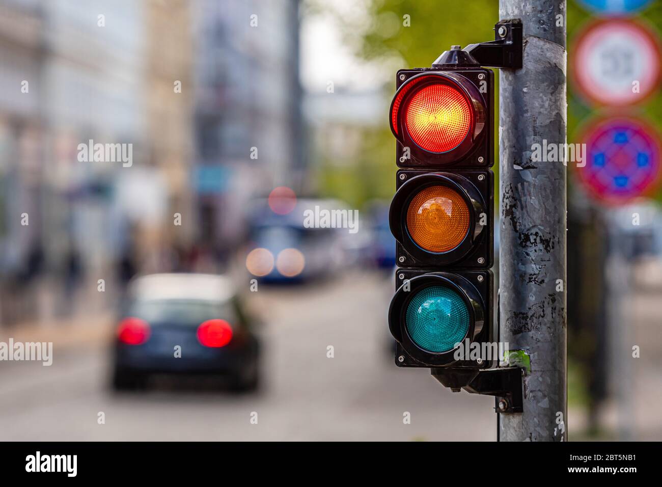 a city crossing with a semaphore, red light in semaphore, traffic ...