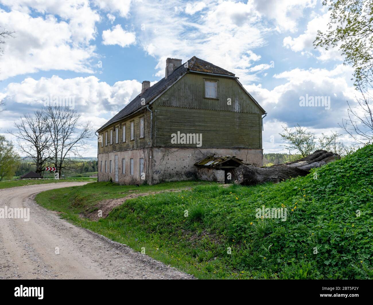 colorful spring landscape with an old two-storey building Stock Photo ...