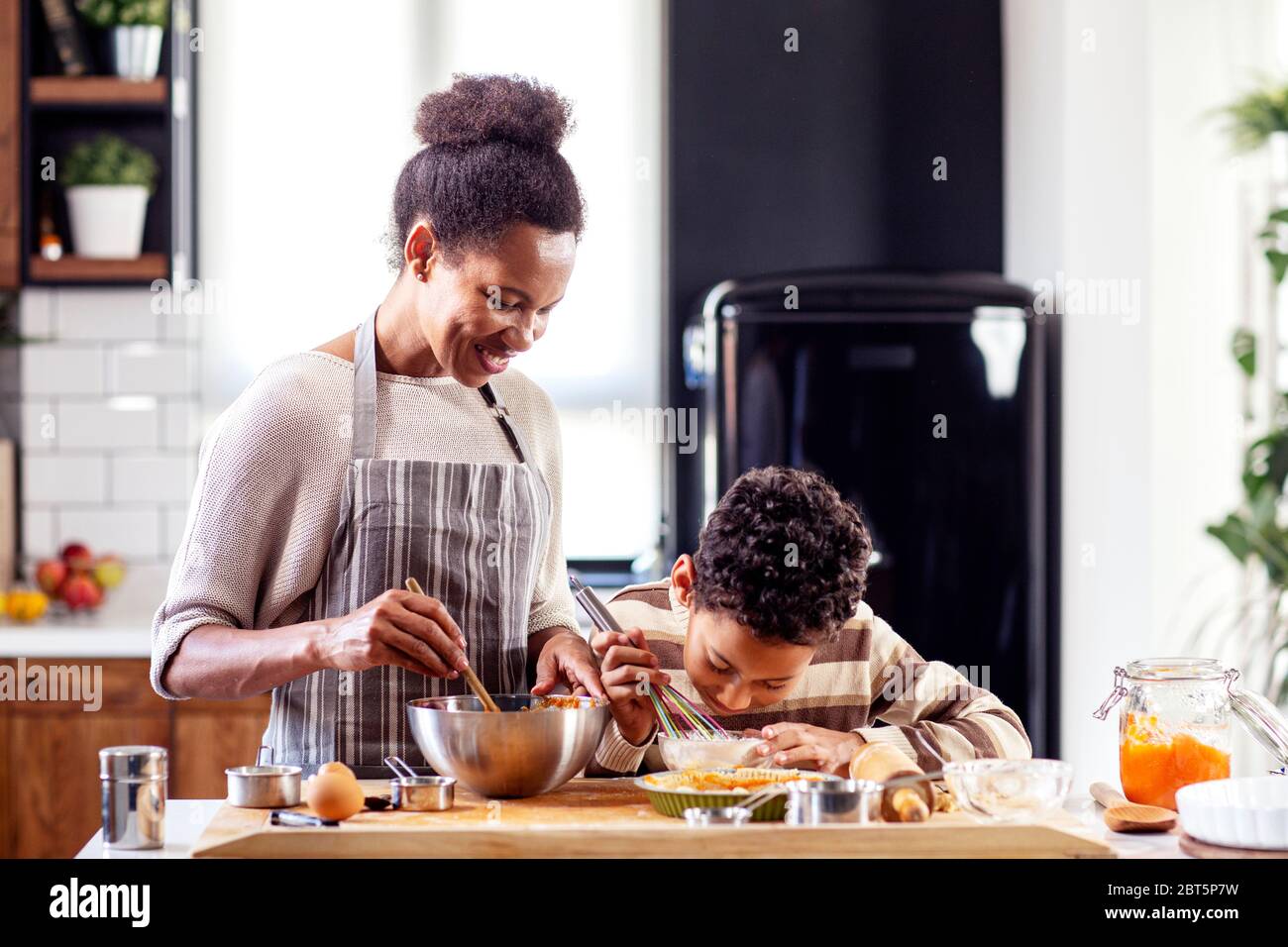 Mum and his son cook in the kitchen Stock Photo - Alamy