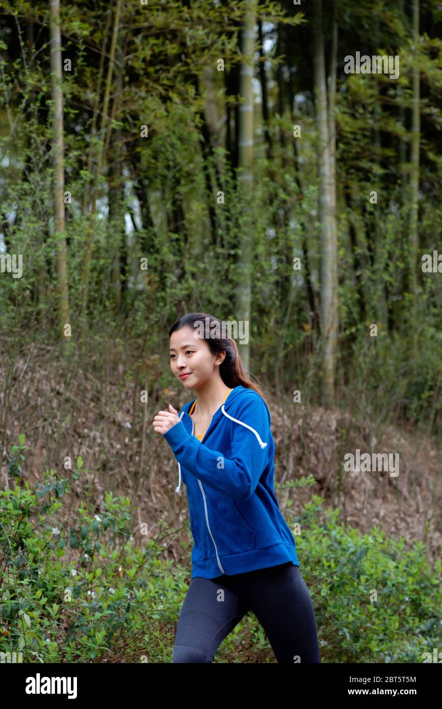 Female running outdoors hi-res stock photography and images - Alamy