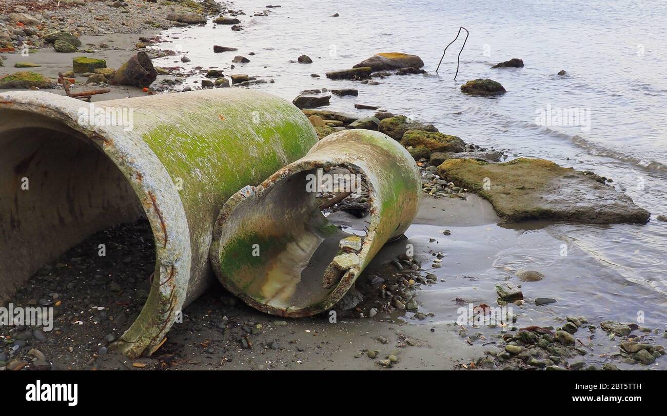 Industrial waste dumped on a river shore Stock Photo - Alamy
