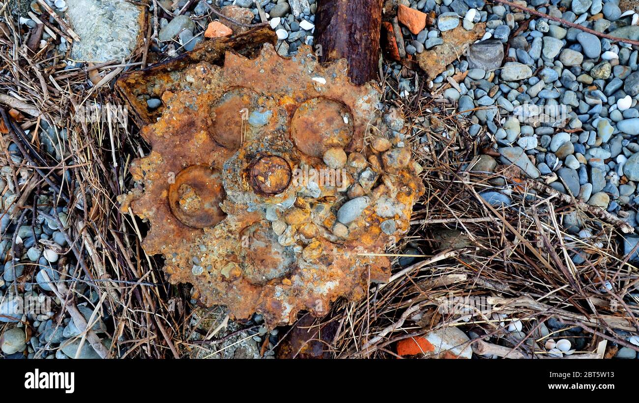 Industrial metal waste rusting away on a river shore Stock Photo - Alamy