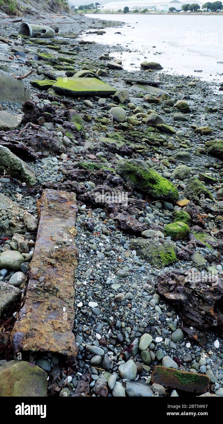 Industrial waste dumped on a river shore Stock Photo - Alamy