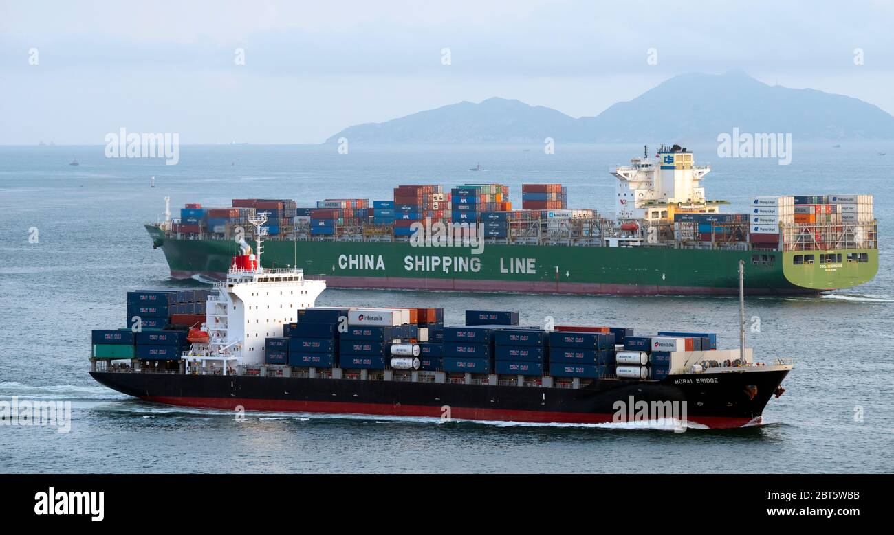 Container ships transporting cargo into Hong Kong from mainland China ...