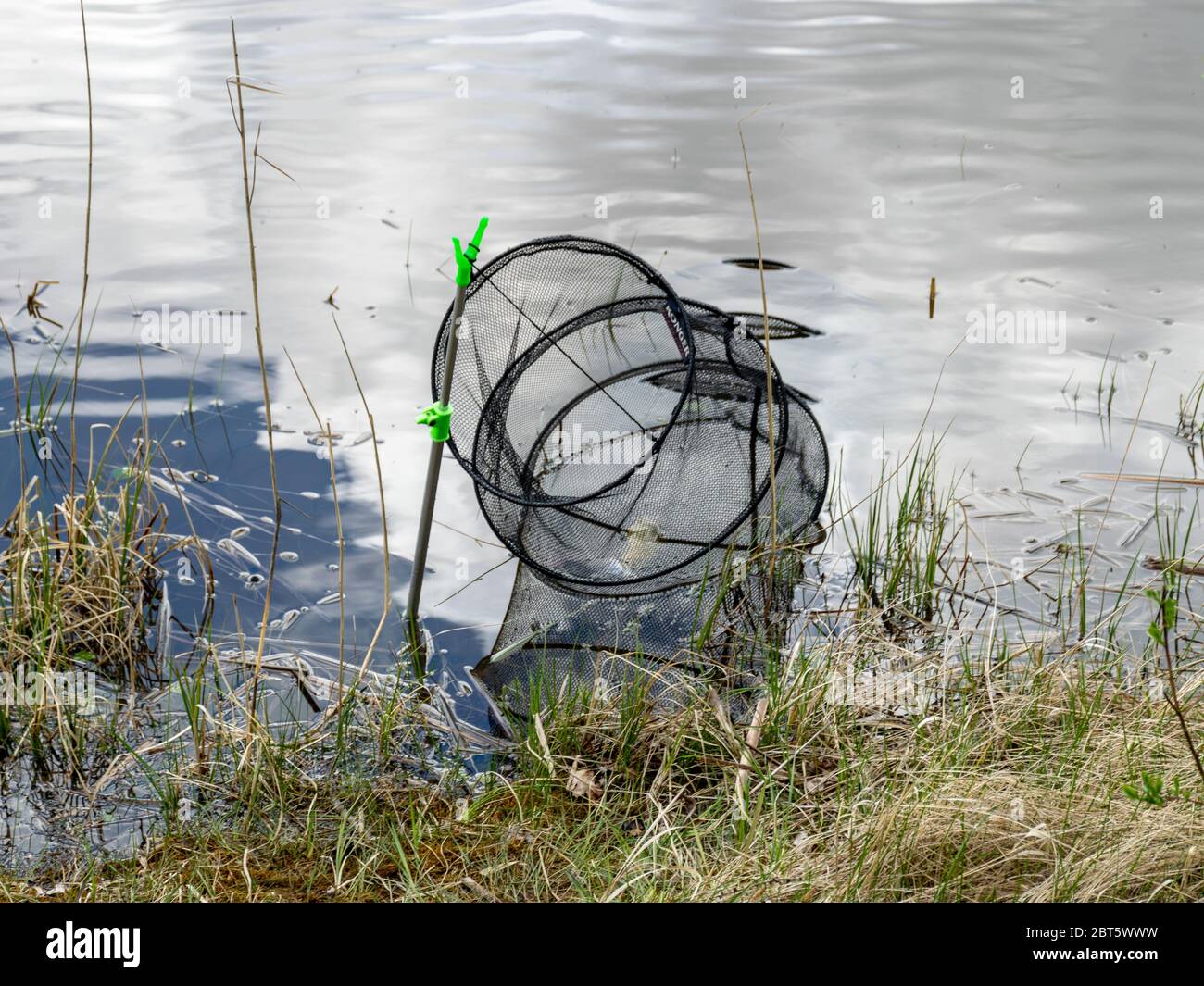 picture with fish net in the water, fishing as a leisure concept, water ...