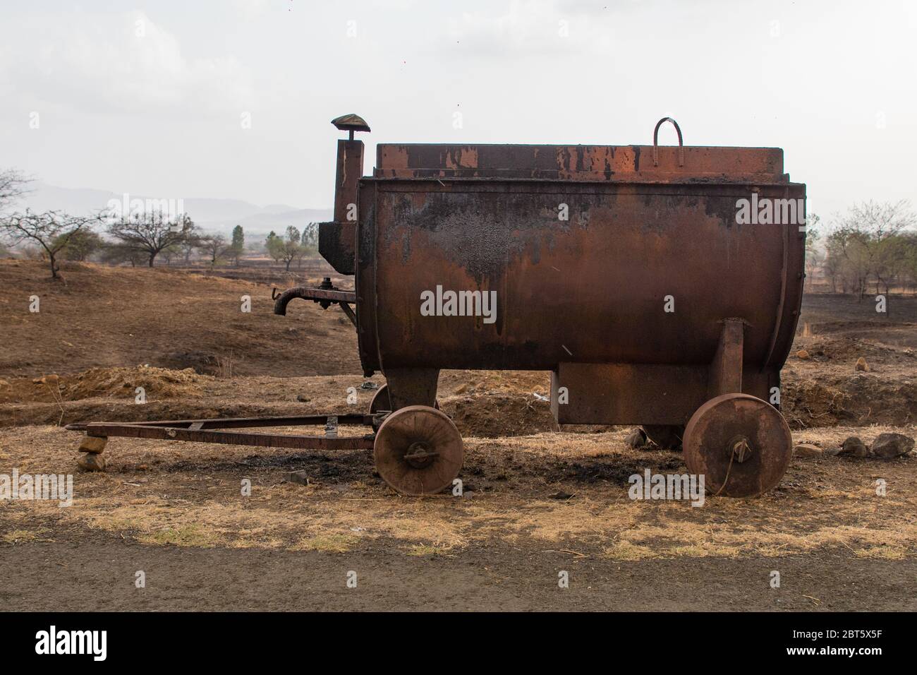 a mobile tar melting furnace with a tank above to melt the tar or ...