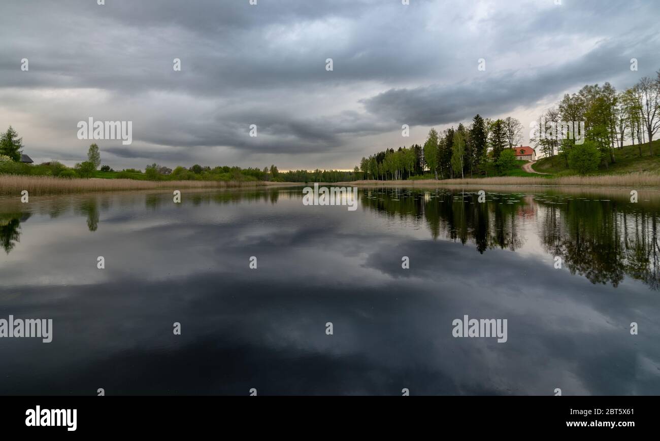 colorful spring landscape with beautiful sky, clouds and tree ...