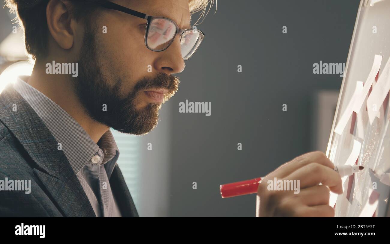 Bearded businessman writing on hi-res stock photography and images - Alamy