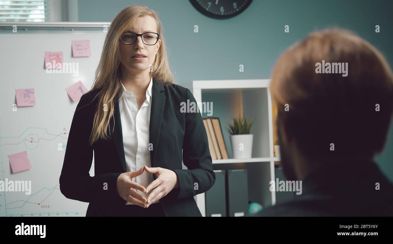 Female expert giving presentation hi-res stock photography and images ...