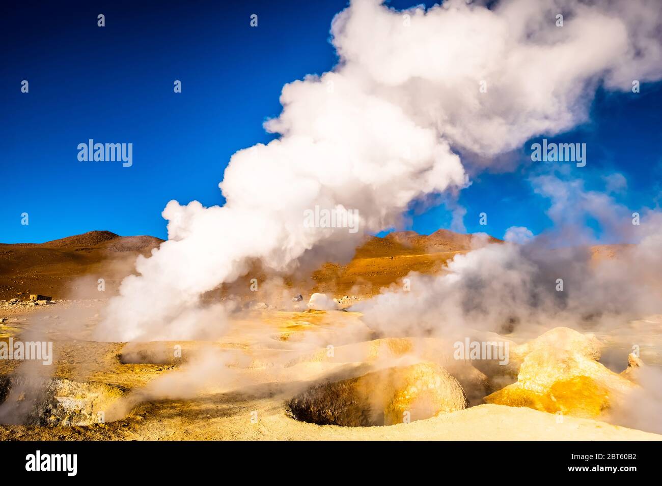 Sunshine Boivian desert landscape with huge steaming geysers Stock ...