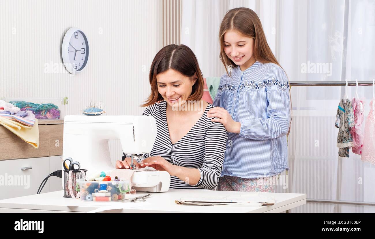 Novice tailor learning from her master art of making templates for ...
